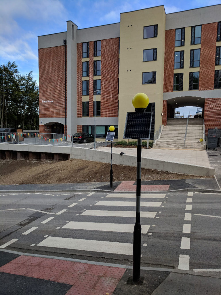 Installation of solar powered pedestrian crossing beacons