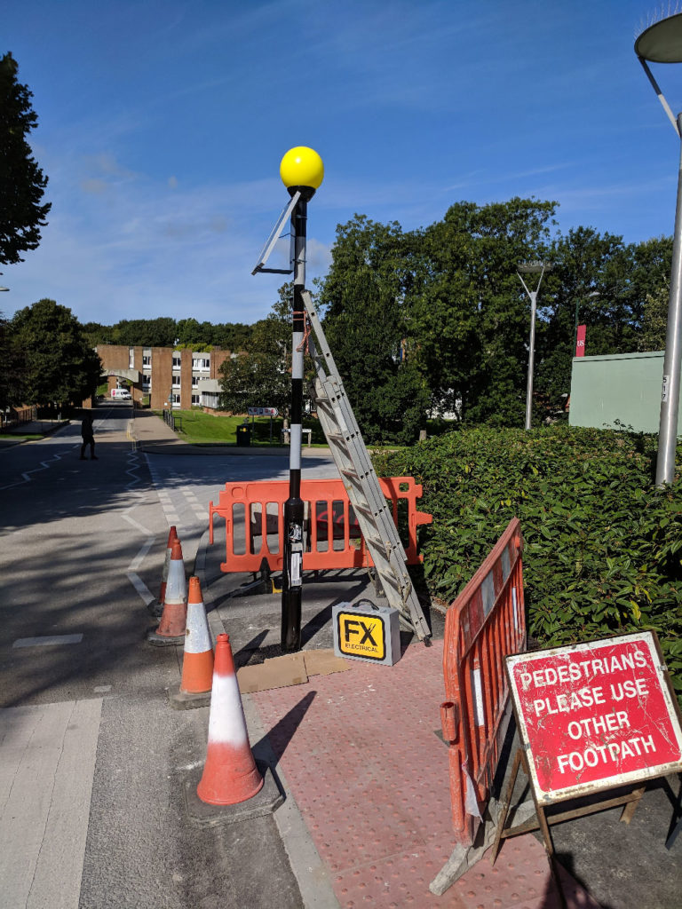 Installation of solar powered pedestrian crossing beacons